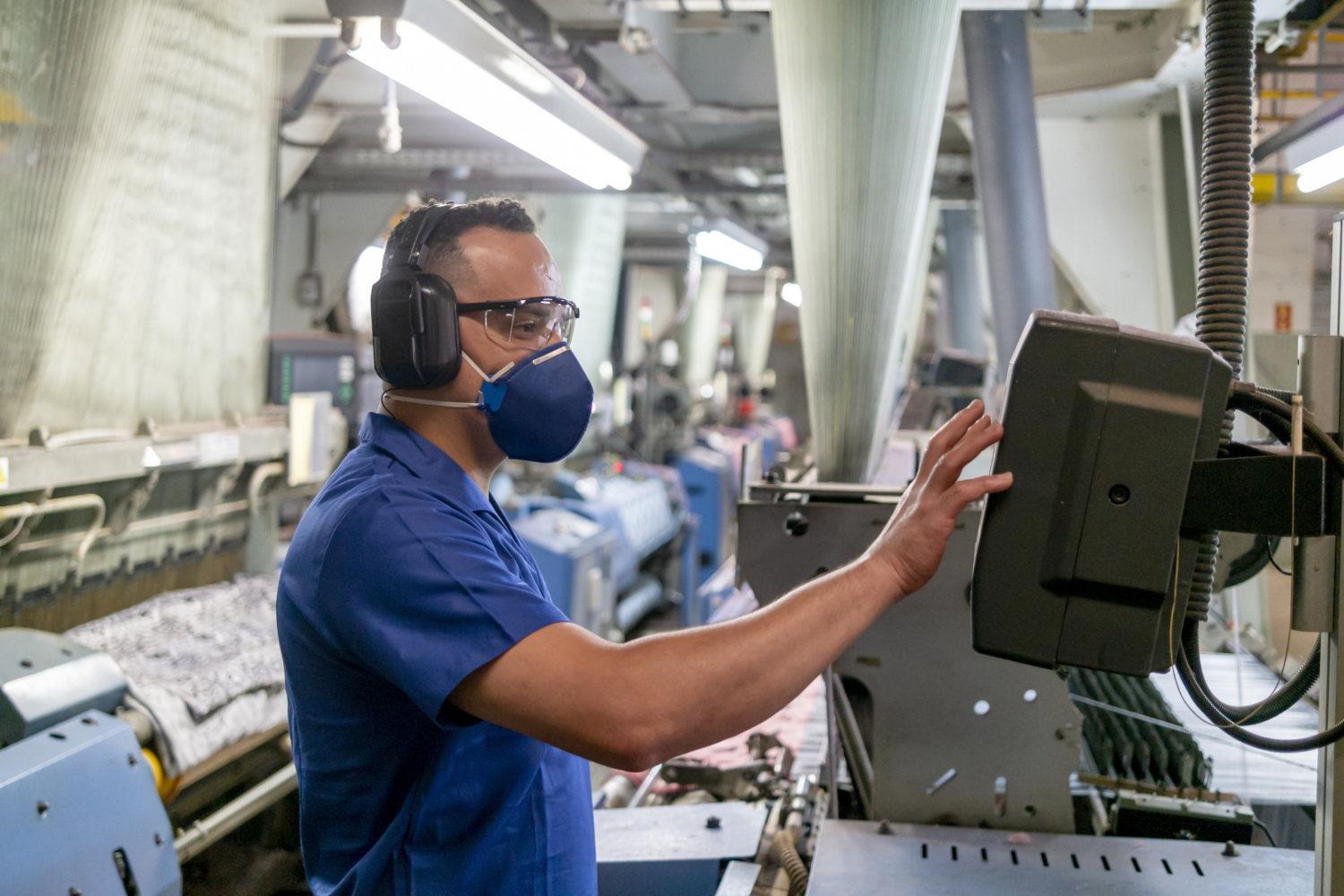Man working in a fabric industry | R&R Lotion®
